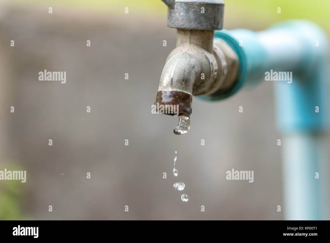 Faucet with a water drop / Water consumption concept Stock Photo - Alamy