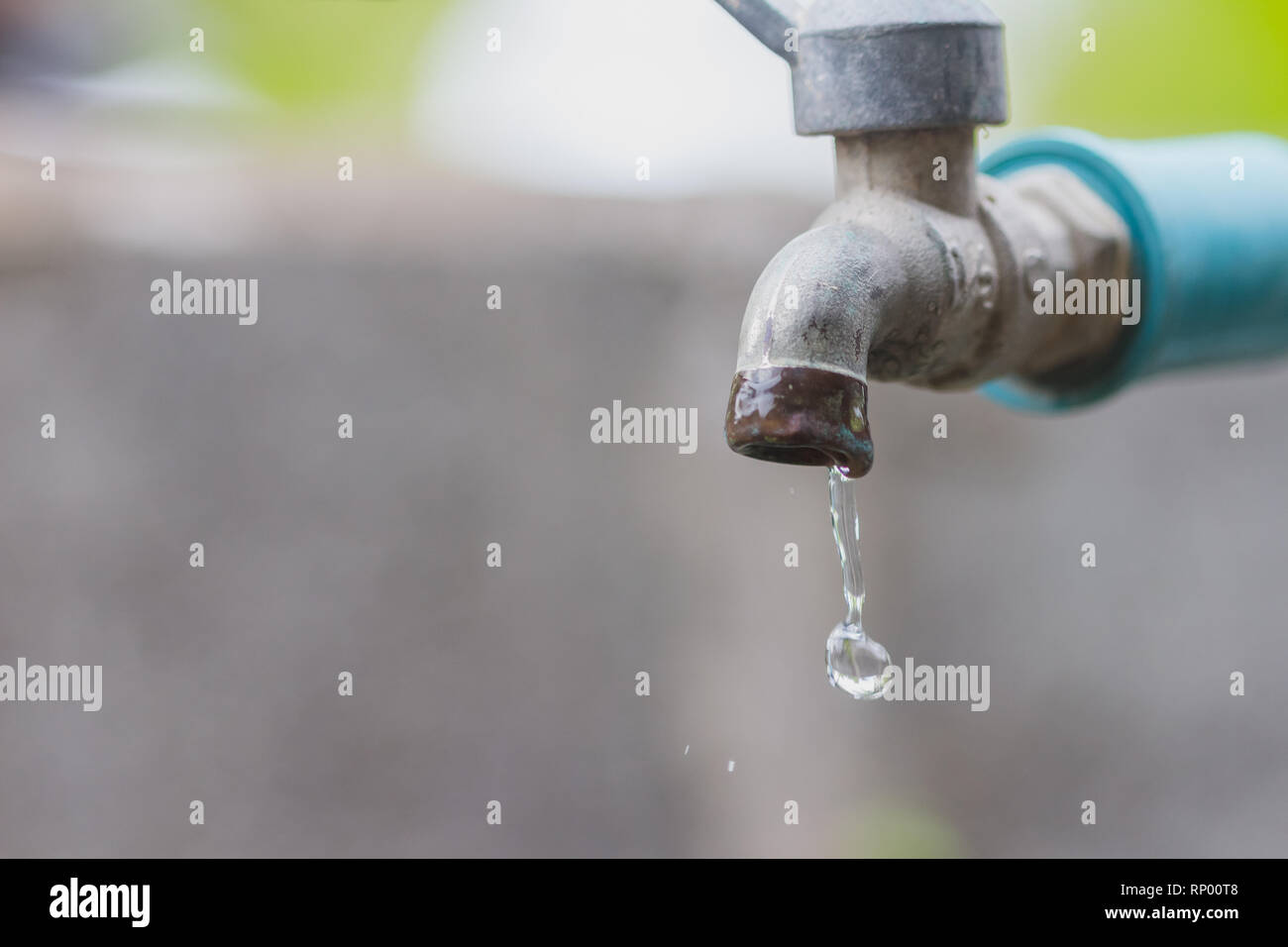 Faucet with a water drop / Water consumption concept Stock Photo - Alamy