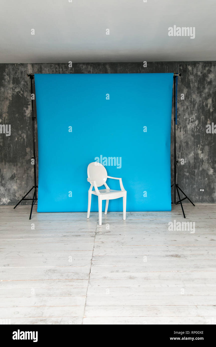 The working space of the photo studio with a blue paper background and ...
