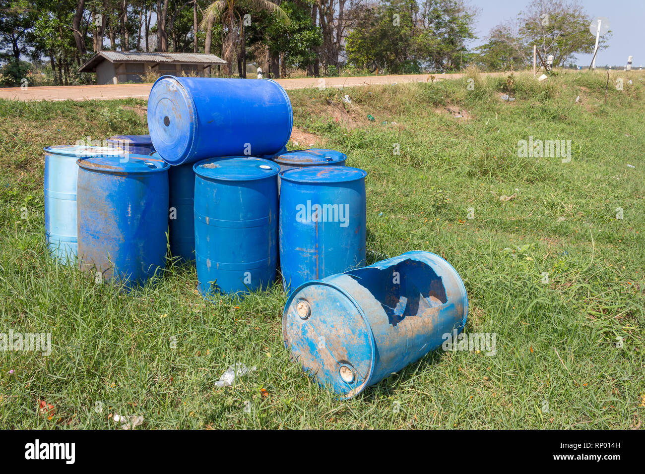 Bin many blue tanks on grass Stock Photo - Alamy