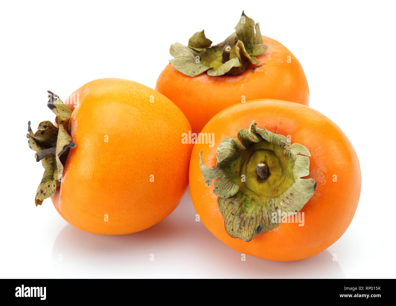 Whole Persimmon fruits isolated on white background Stock Photo - Alamy