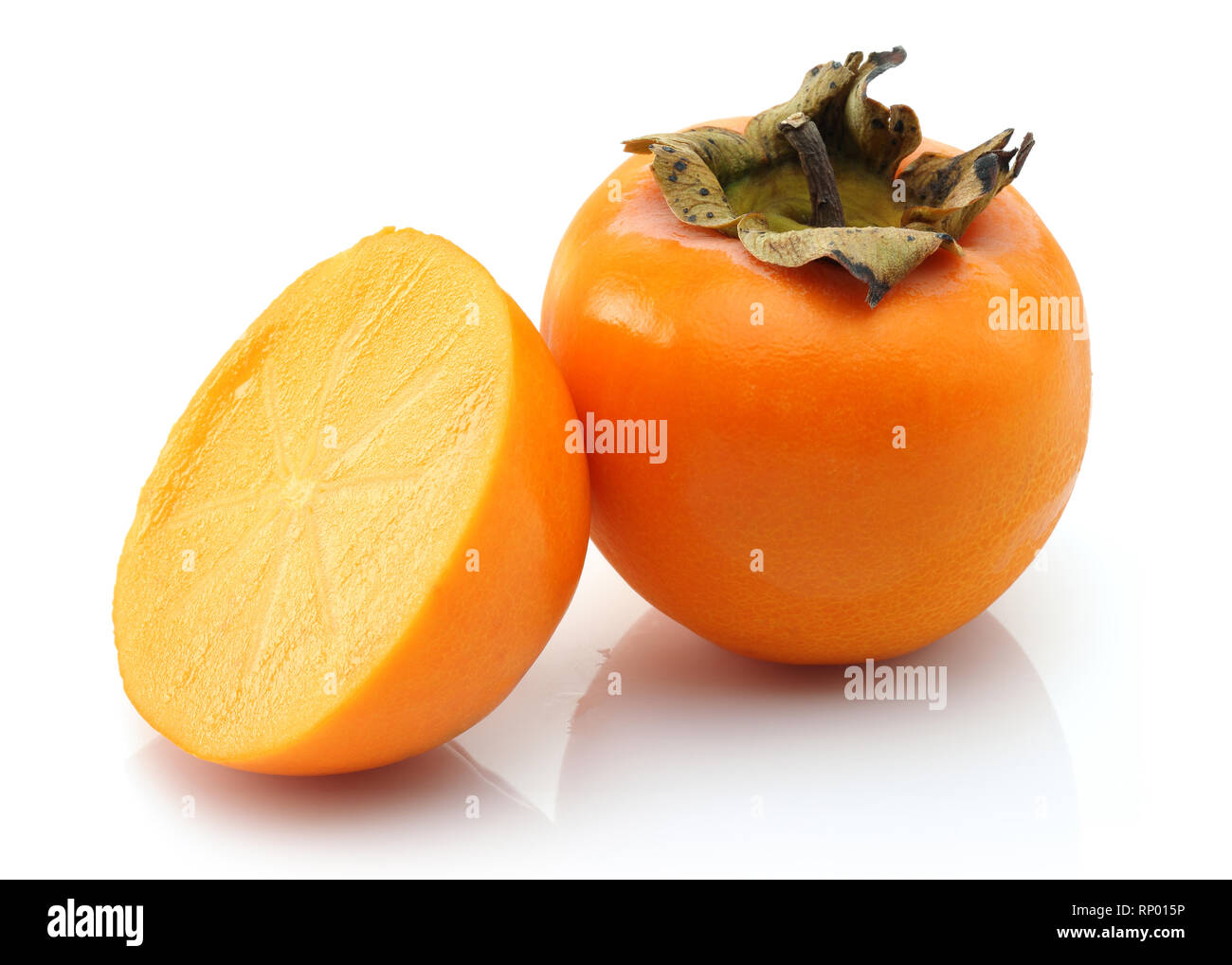 Half and whole Persimmon fruits isolated on white background Stock ...