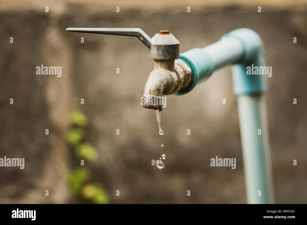 Faucet with a water drop / Water consumption concept Stock Photo - Alamy