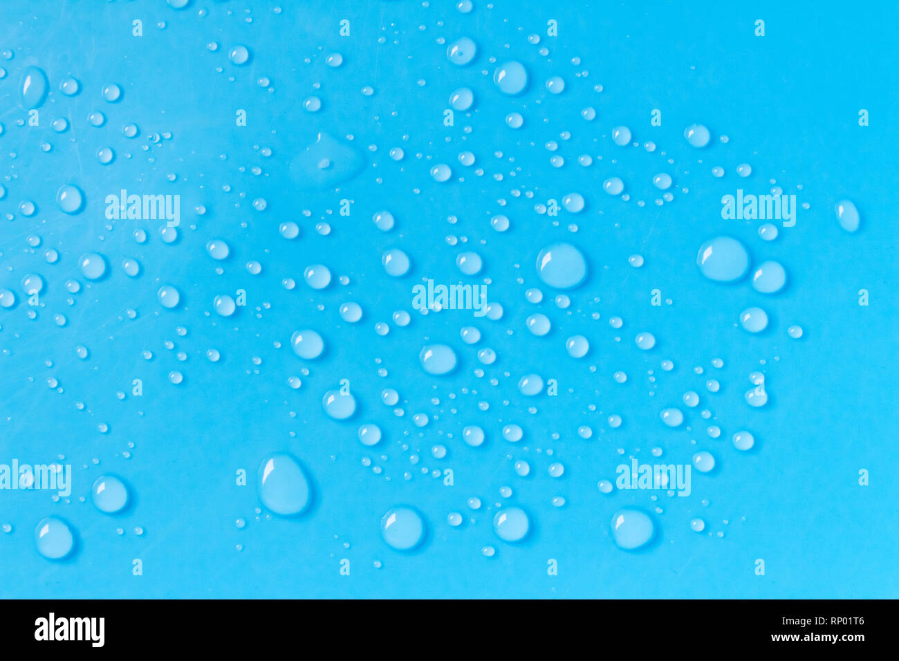 Blue background with water droplets Stock Photo - Alamy