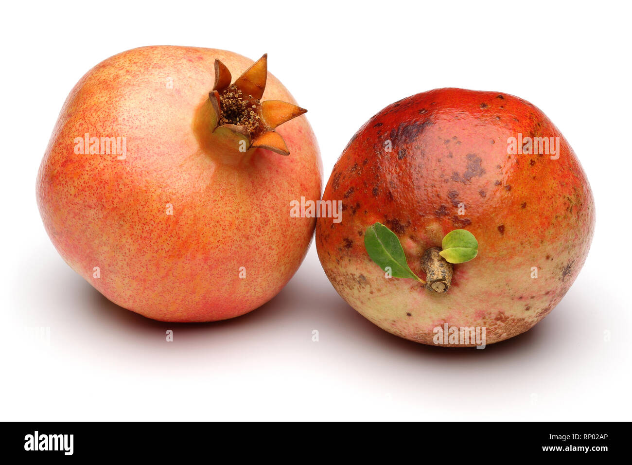 Whole pomegranate fruits isolated on white background Stock Photo - Alamy