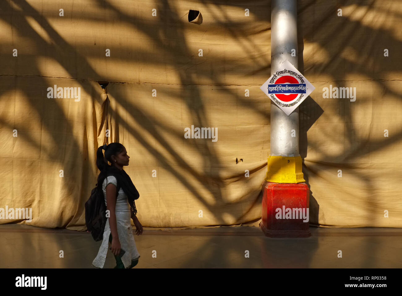 A woman at (railway station) Chhatrapati Shivaji Maharaj Terminus (CSMT ...