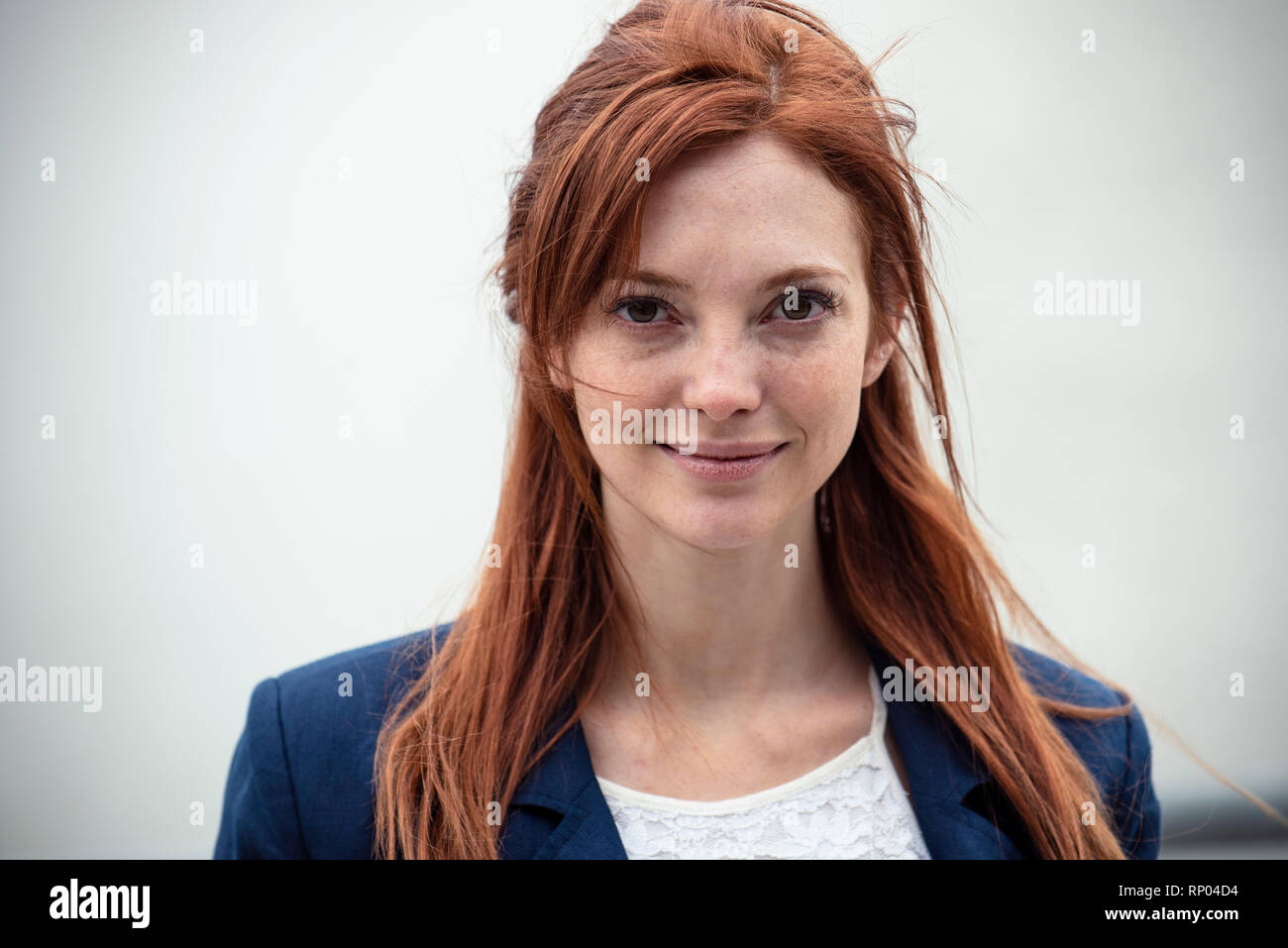 Standing and smiling hi-res stock photography and images - Alamy