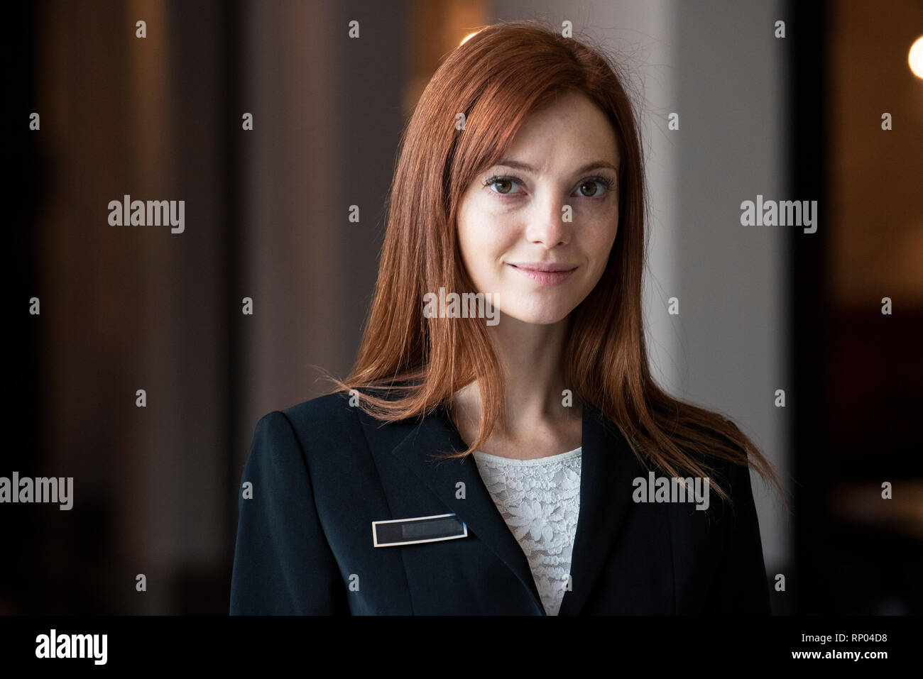 Female hotel receptionist hi-res stock photography and images - Alamy