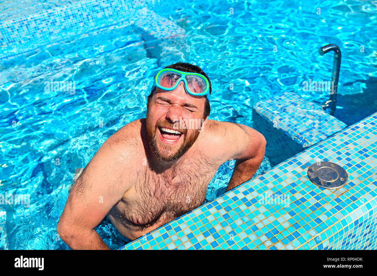 Funny man in diving mask jumping in pool, top view Stock Photo - Alamy