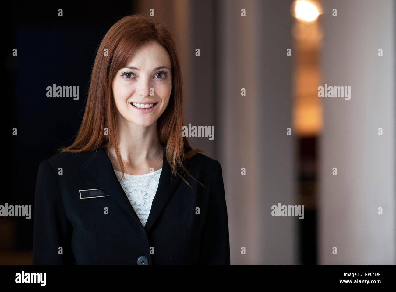 Female hotel receptionist hi-res stock photography and images - Alamy