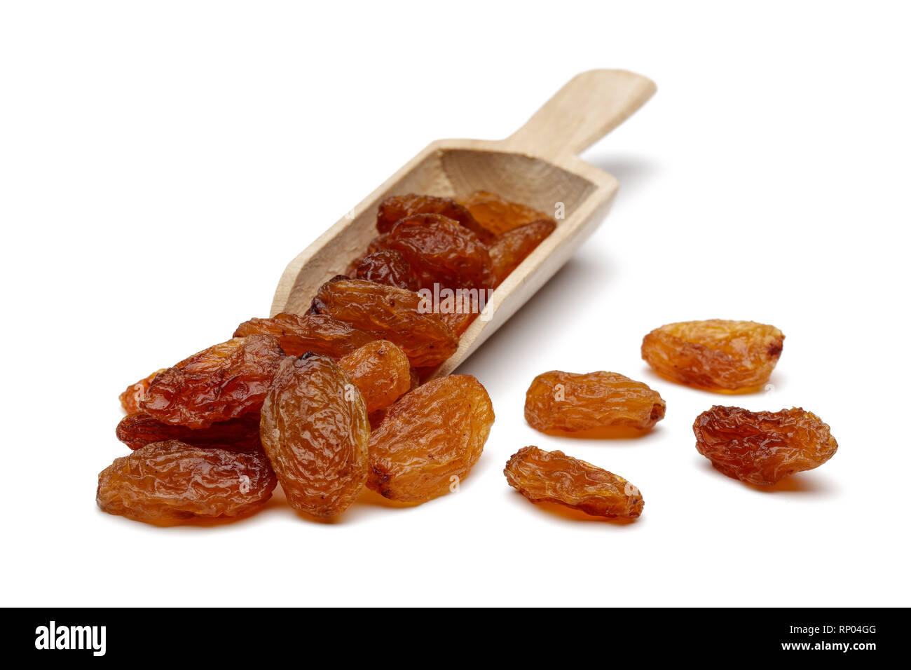 Golden raisin in wooden spoon isolated on white background Stock Photo ...