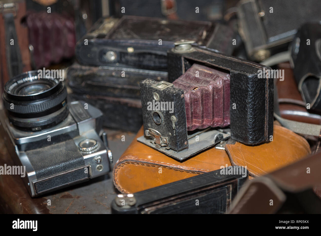 Antique Folding Camera with Bellows in a Pile of Old Cameras Stock ...