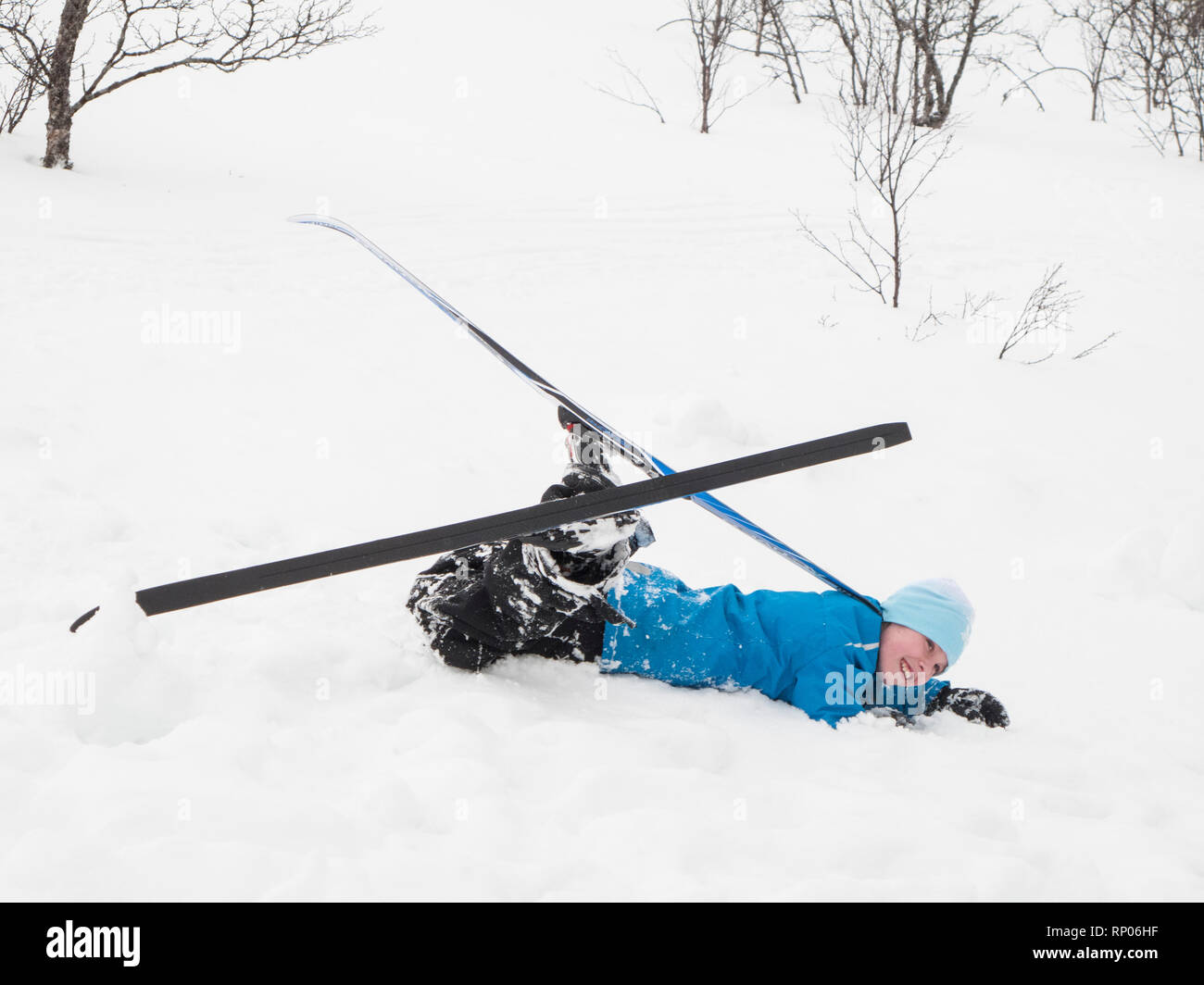 A twelve years old boy trying to ski, but falls Stock Photo - Alamy