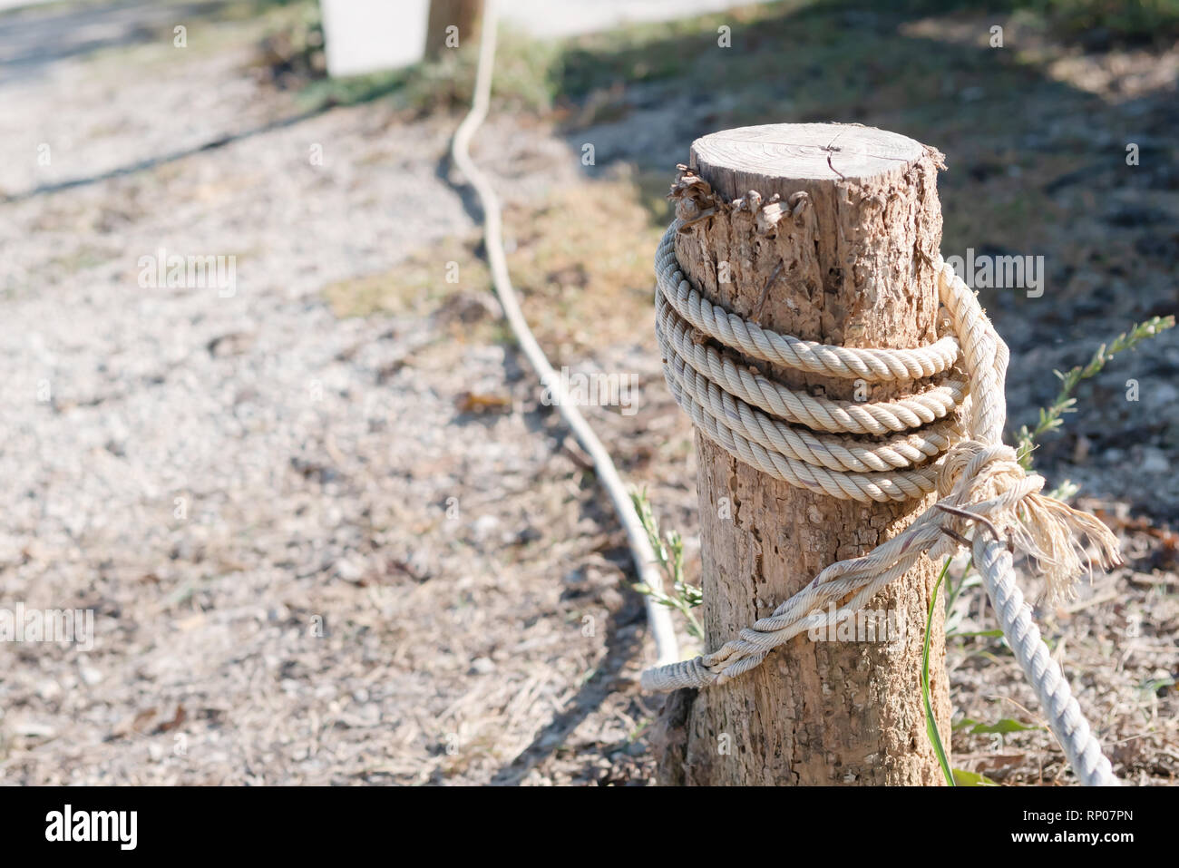 Old rope tied wooden pole hi-res stock photography and images - Alamy