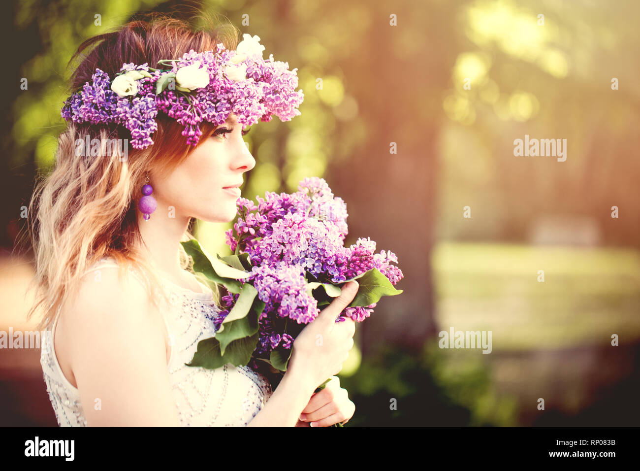 Beautiful woman face outdoors portrait. Girl with spring flowers ...