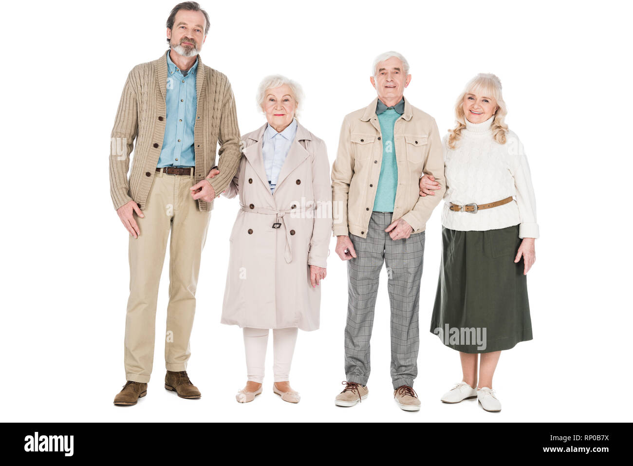 cheerful retired people standing and smiling isolated on white Stock ...