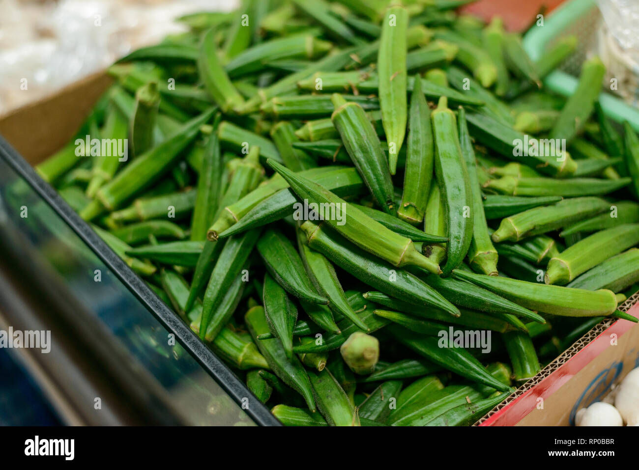 Tray of fresh okra pods Stock Photo - Alamy