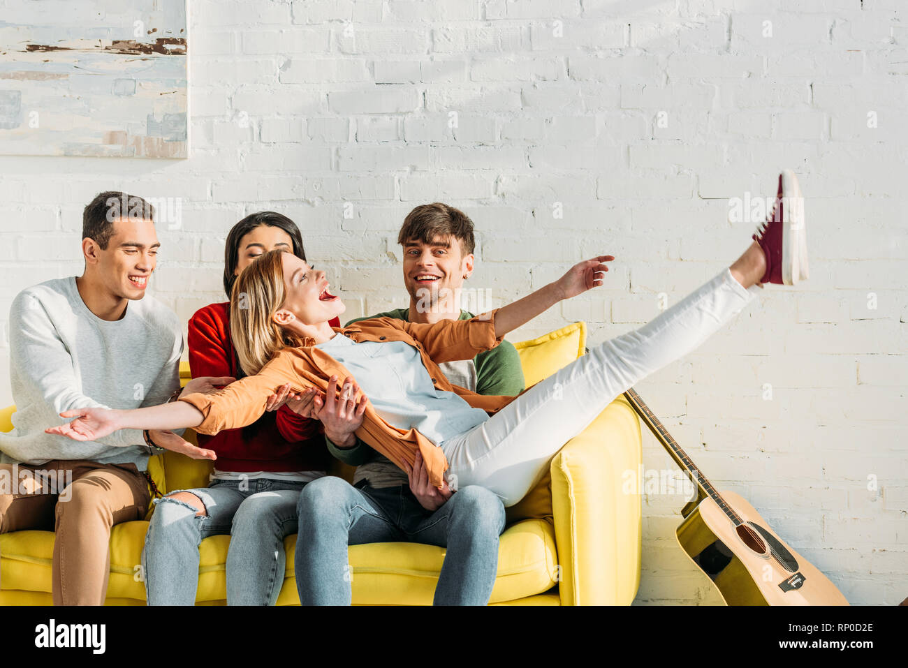 multicultural friends having fun and fooling around at home Stock Photo ...