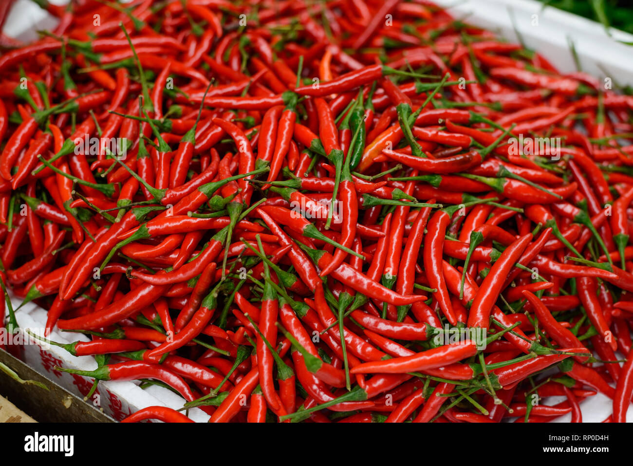 Red chili peppers in box Stock Photo - Alamy