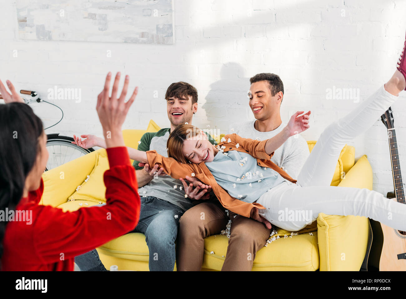 multiethnic friends having fun and fooling around at home party Stock ...