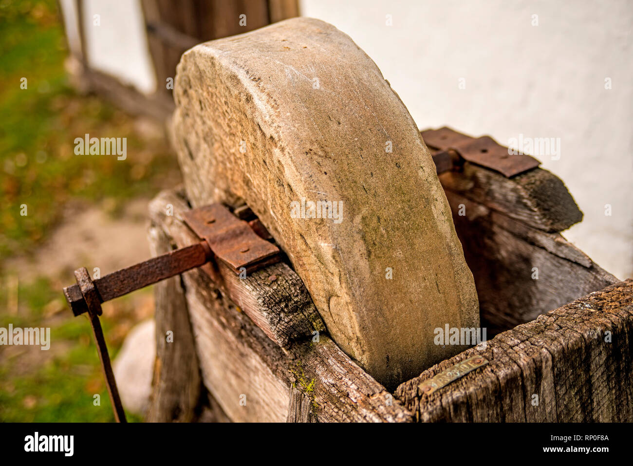 old rotary grindstone at a country house Stock Photo - Alamy