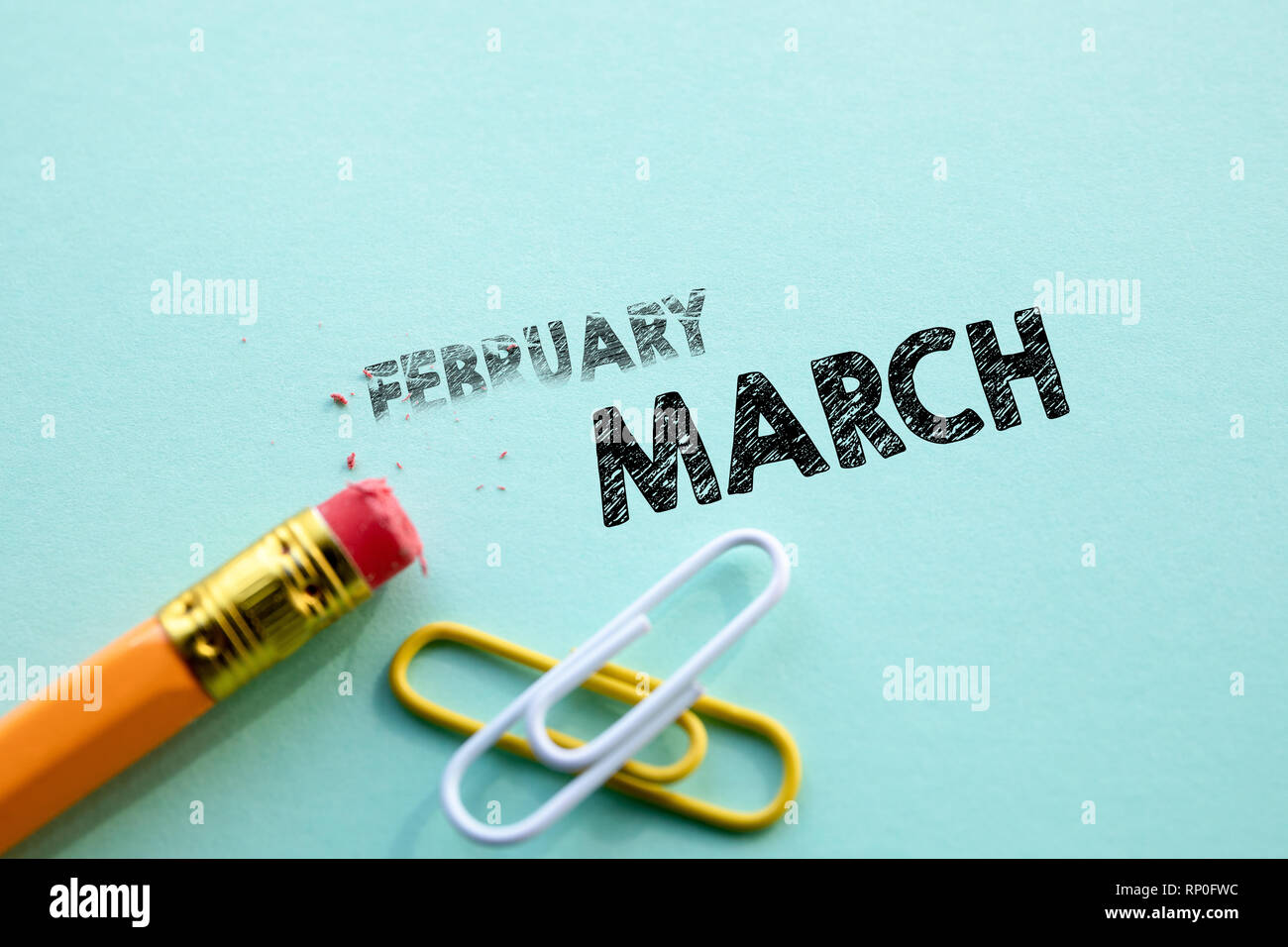 Making February in to March by eraser. Concept for action and reaching ...