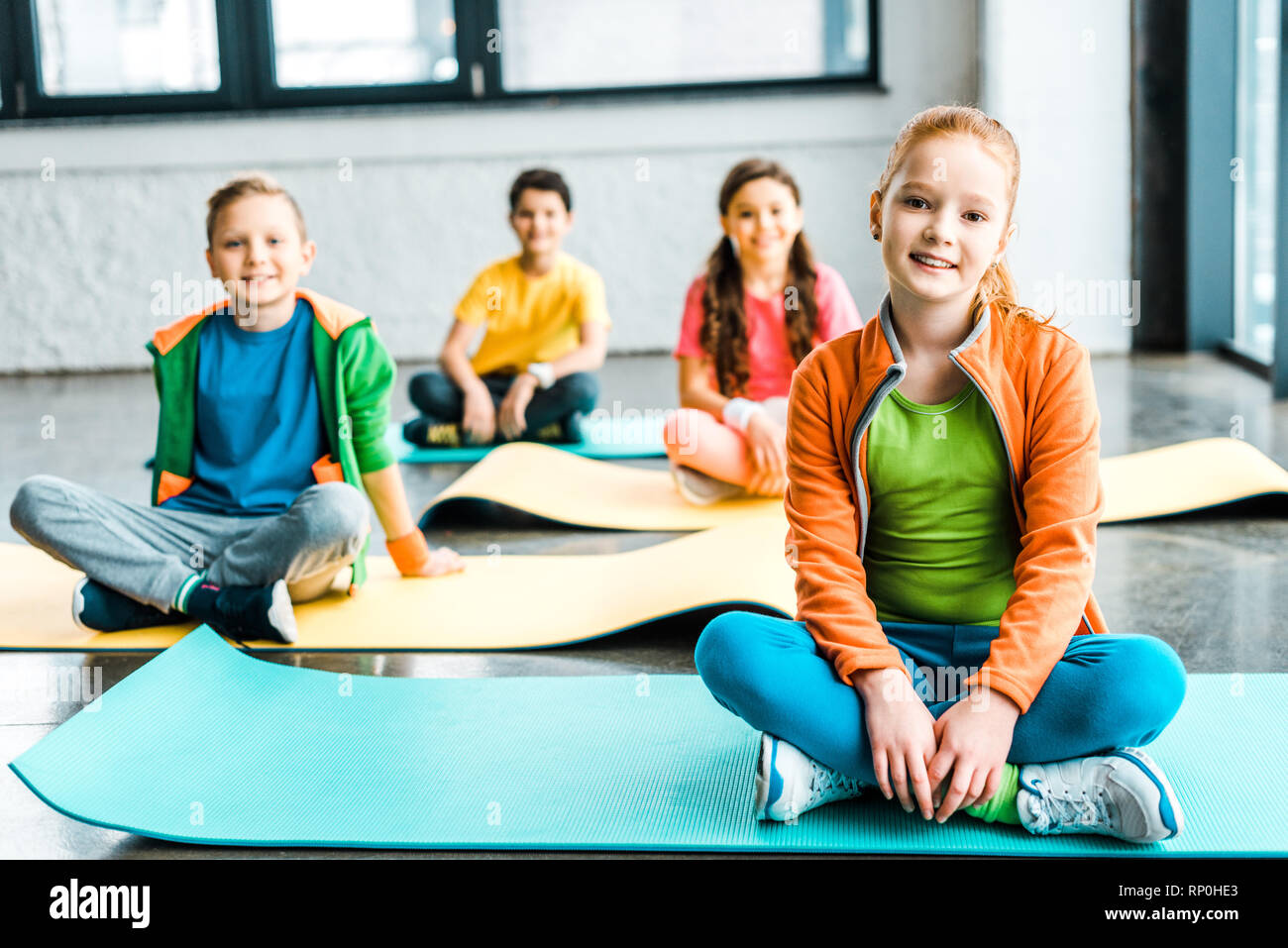 Children on mats hi-res stock photography and images - Alamy