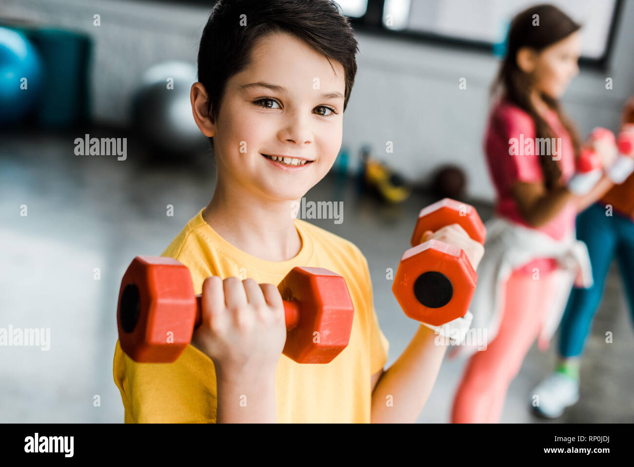 Boy in gym dumbbells hi-res stock photography and images - Alamy
