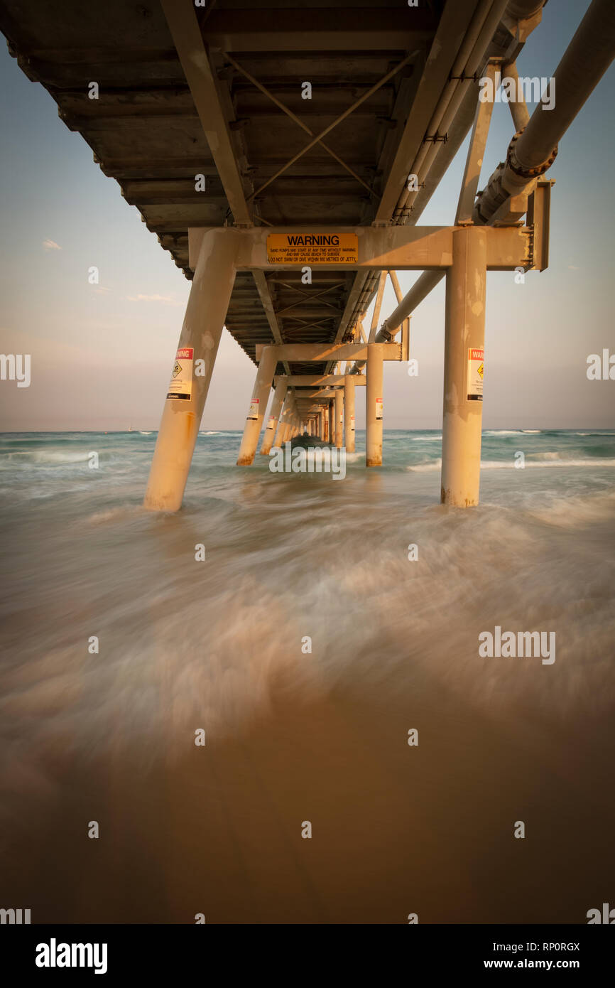 A view from under the sand pumping jetty located on the Spit on ...