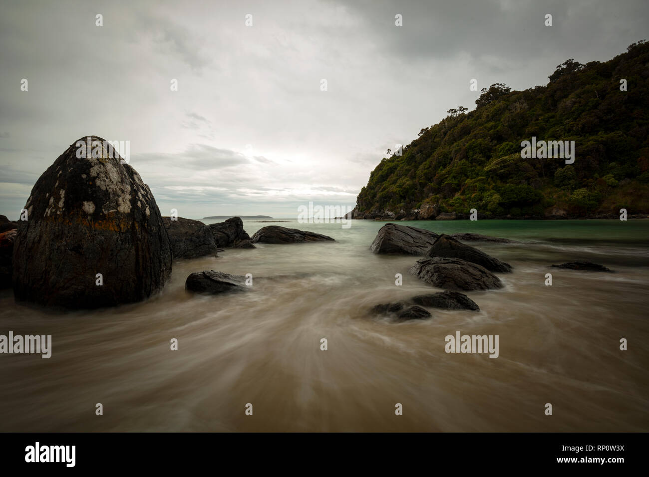 A view from a beach on Stewart Island, New Zealand. Stewart Island is ...