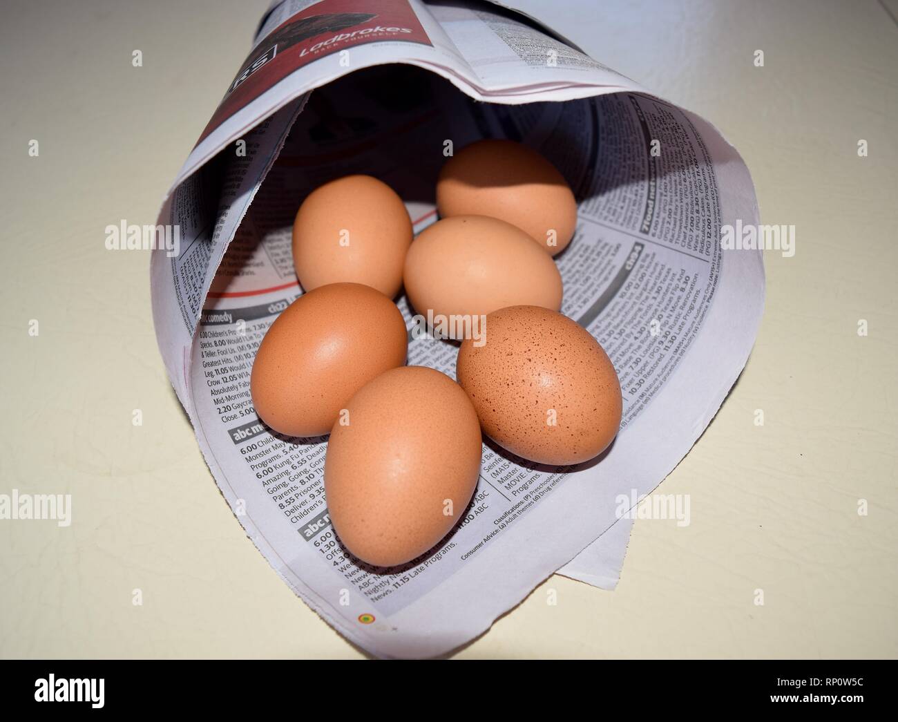 Easter design with eggs and newspapers Stock Photo - Alamy