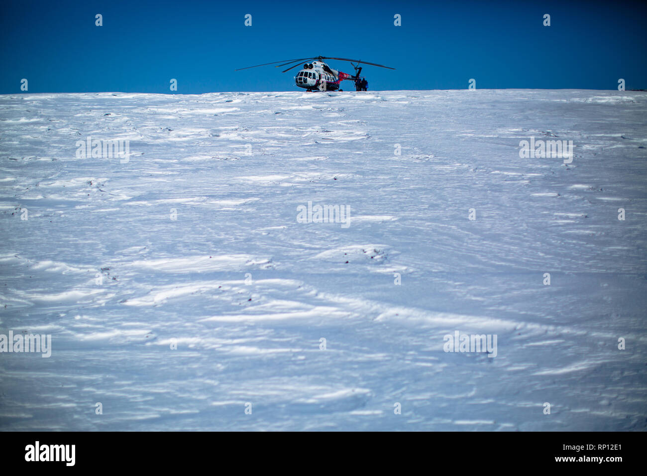 A helicopter landing on snow in Russia Stock Photo - Alamy