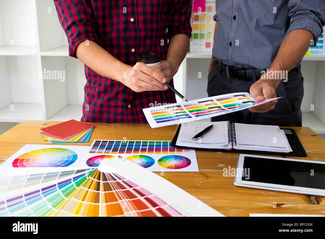 Graphic designers choose colors from the color bands samples for design ...