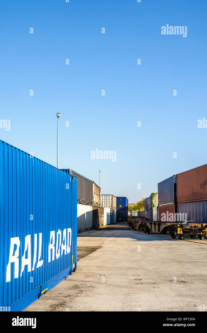 Stack of shipping containers with train hi-res stock photography and ...