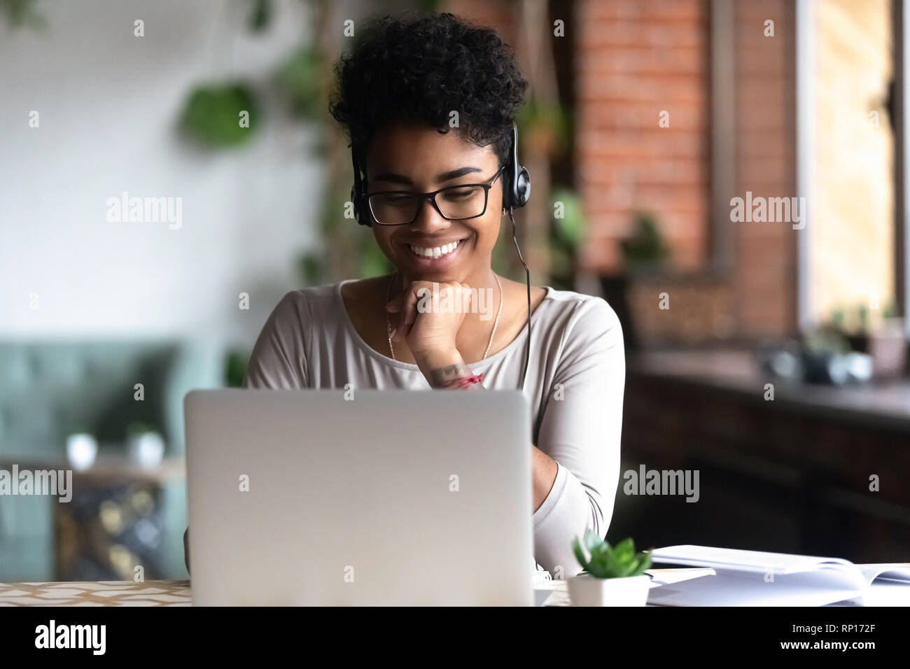 Smart student learning using internet and headphones Stock Photo - Alamy