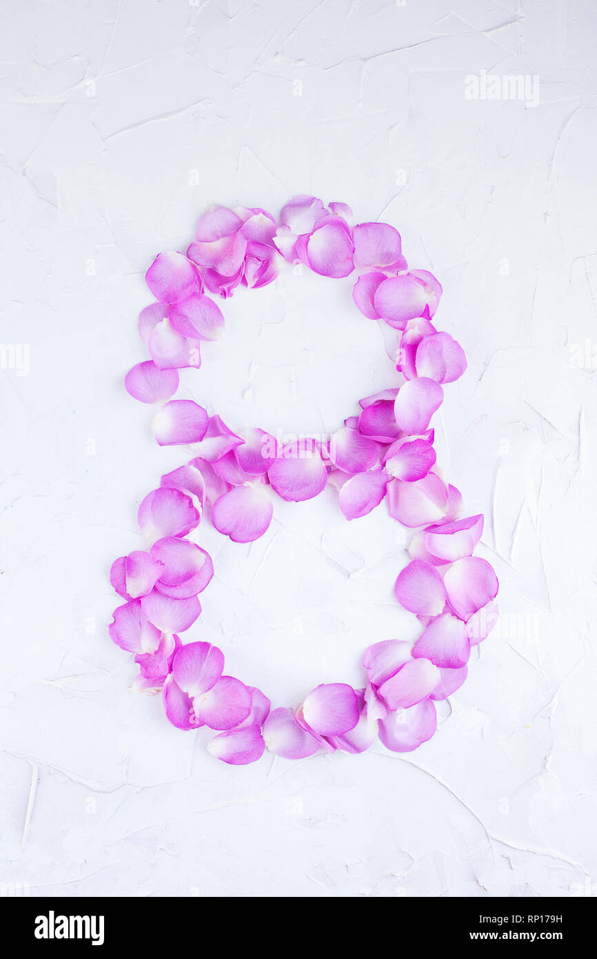 The figure 8 of rose petals on a white background. Pink roses for women ...