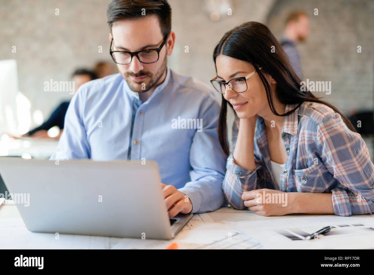 Engineering team working together in hi-res stock photography and ...
