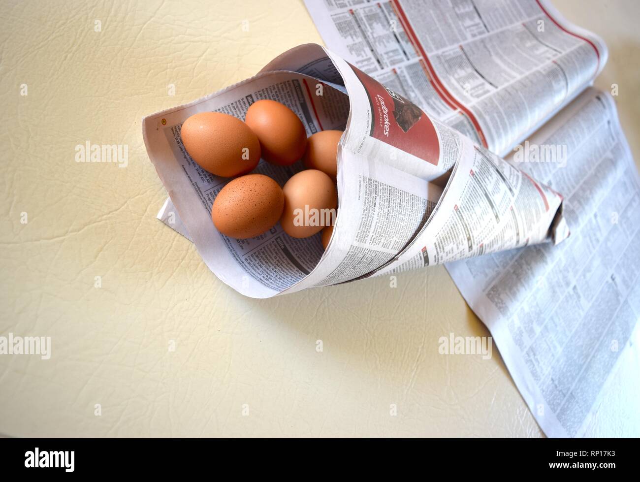 Easter design with eggs and newspapers Stock Photo - Alamy