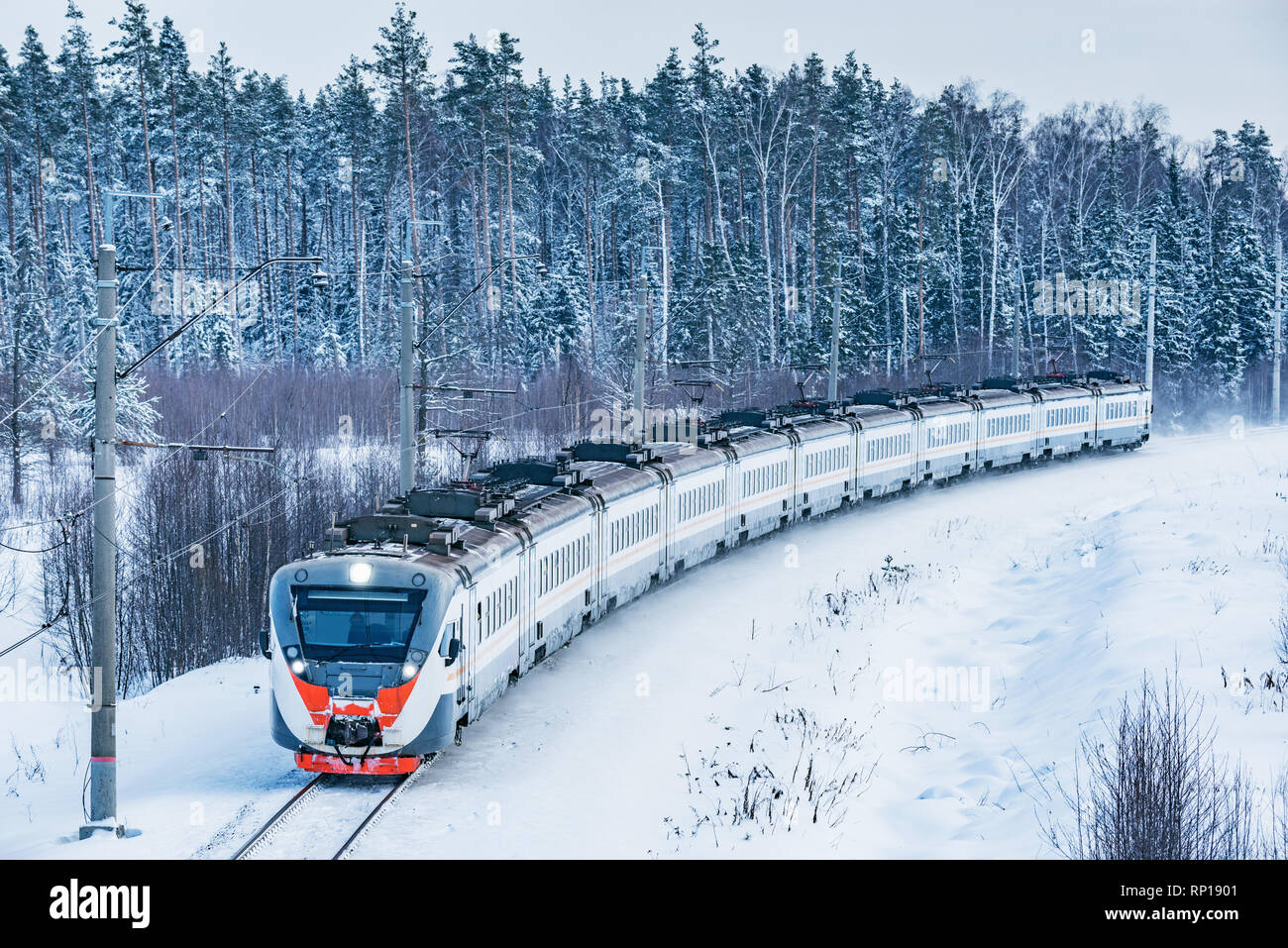 Modern high-speed train approaches to the station Stock Photo - Alamy
