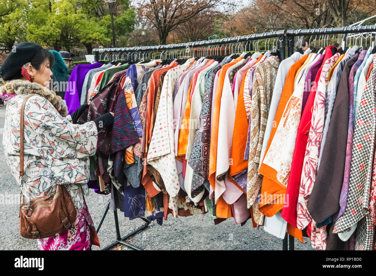 Japan, Honshu, Tokyo, Yoyogi Park, Oedo Antique Market, Girl Buying ...