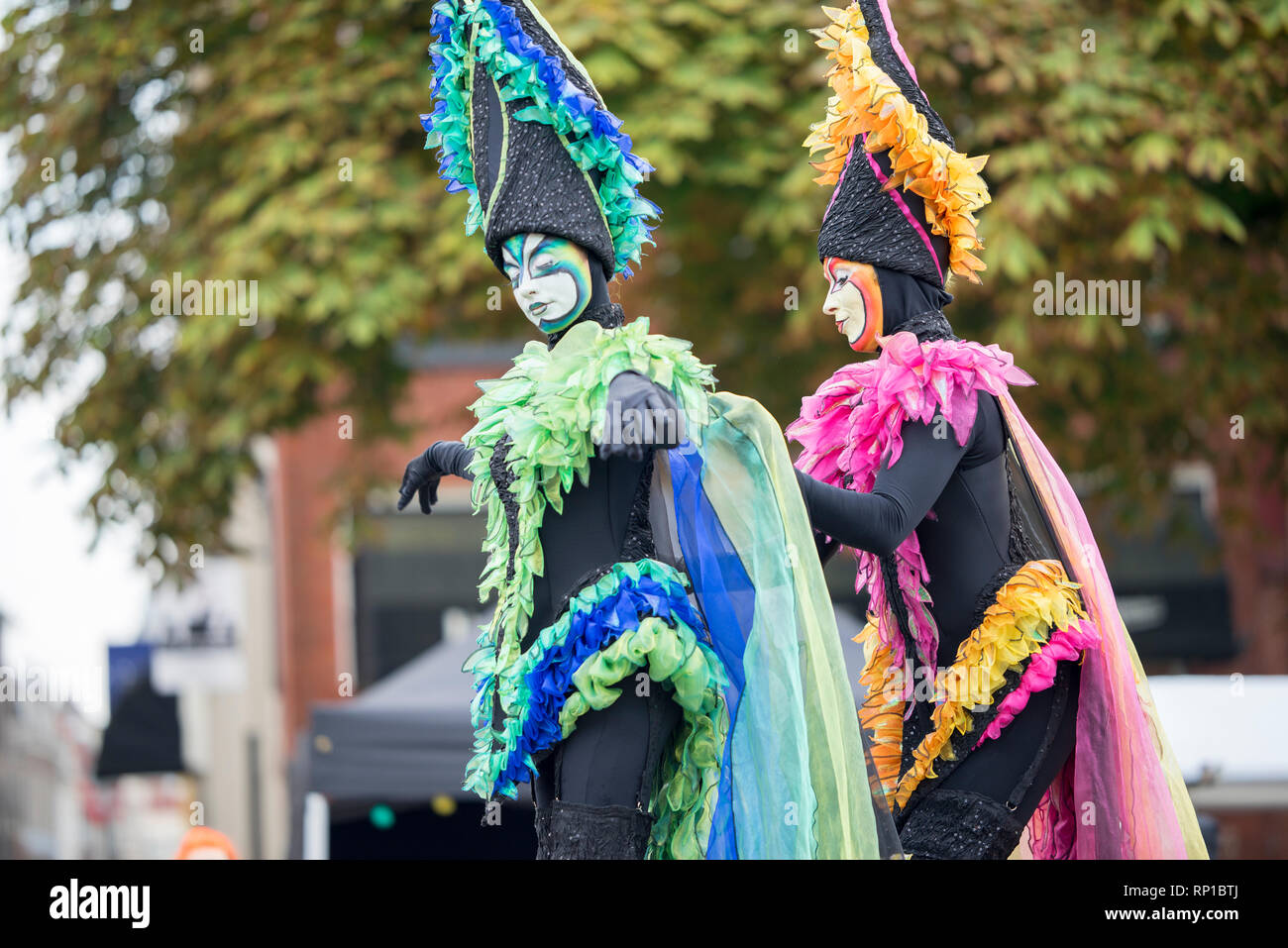 Performers on stilts putting up a show at the Saturday fish market ...