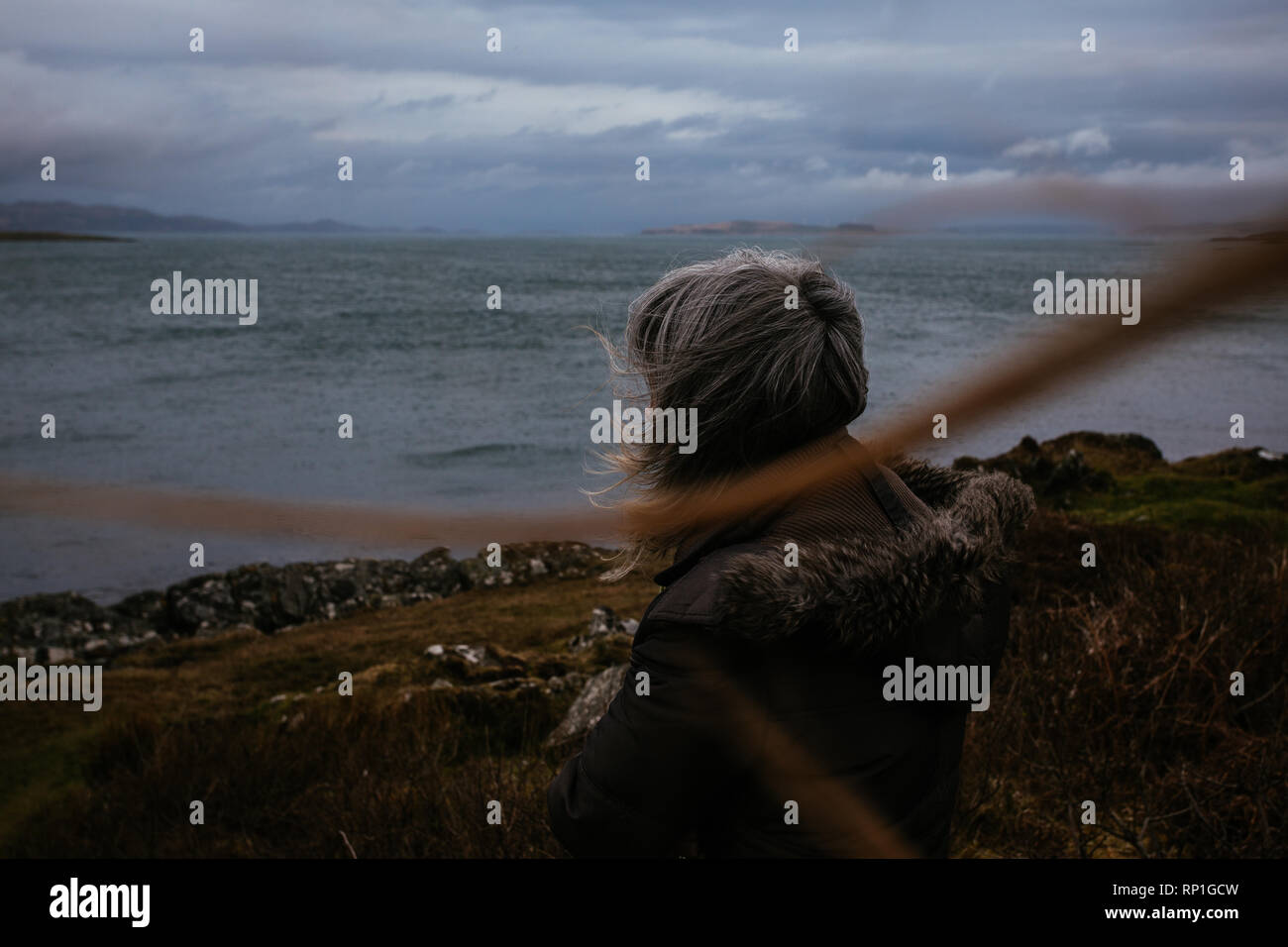 Woman in wind scotland hi-res stock photography and images - Alamy