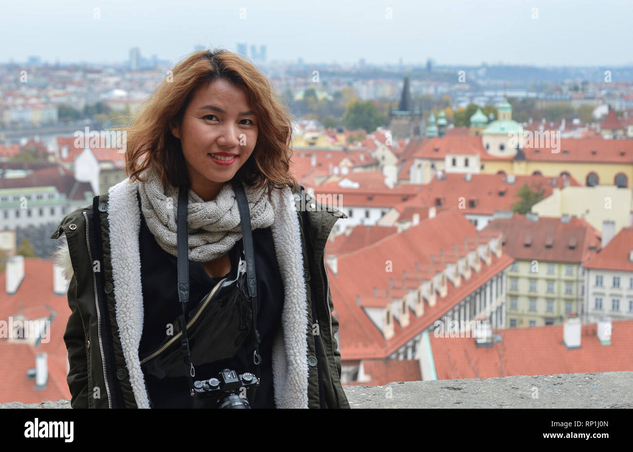 Asian woman sitting on observatory of Prague, Czech Republic Stock ...