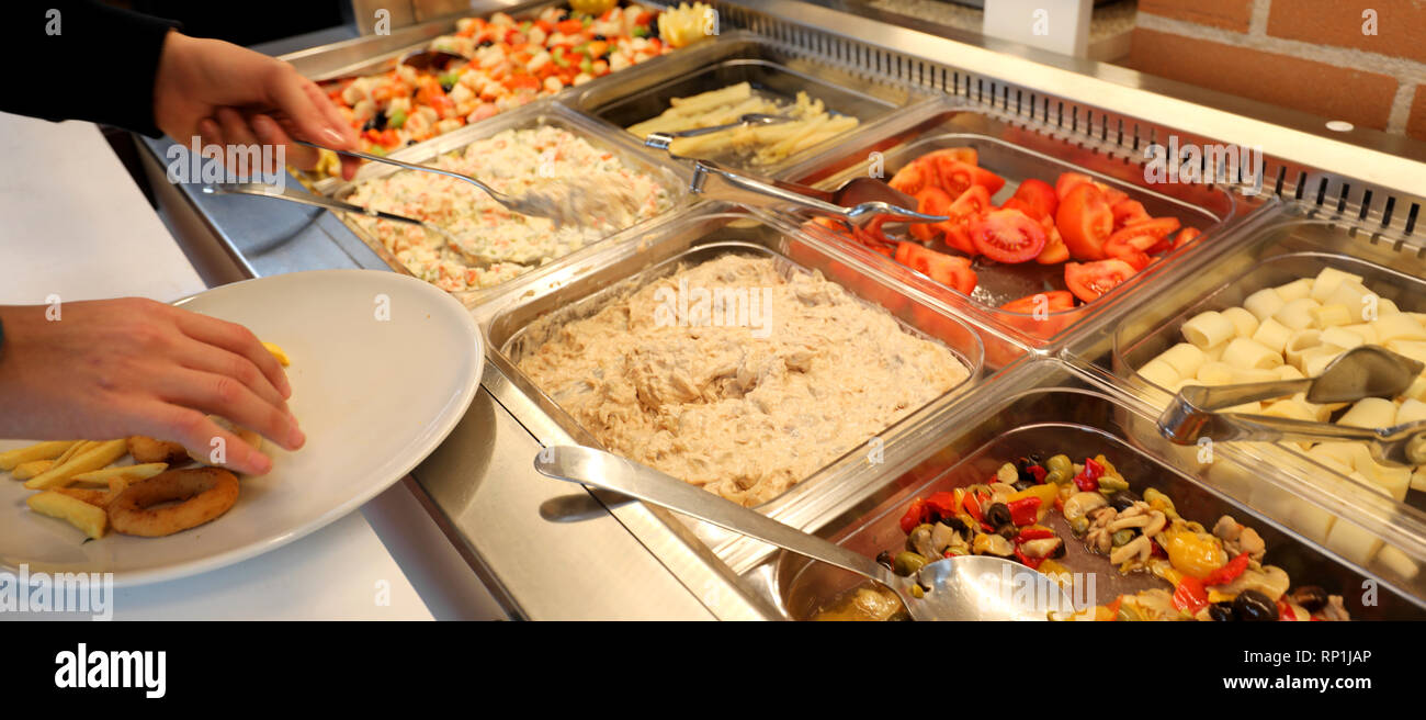 Inside a self service restaurant with raw and cooked foods Stock Photo ...