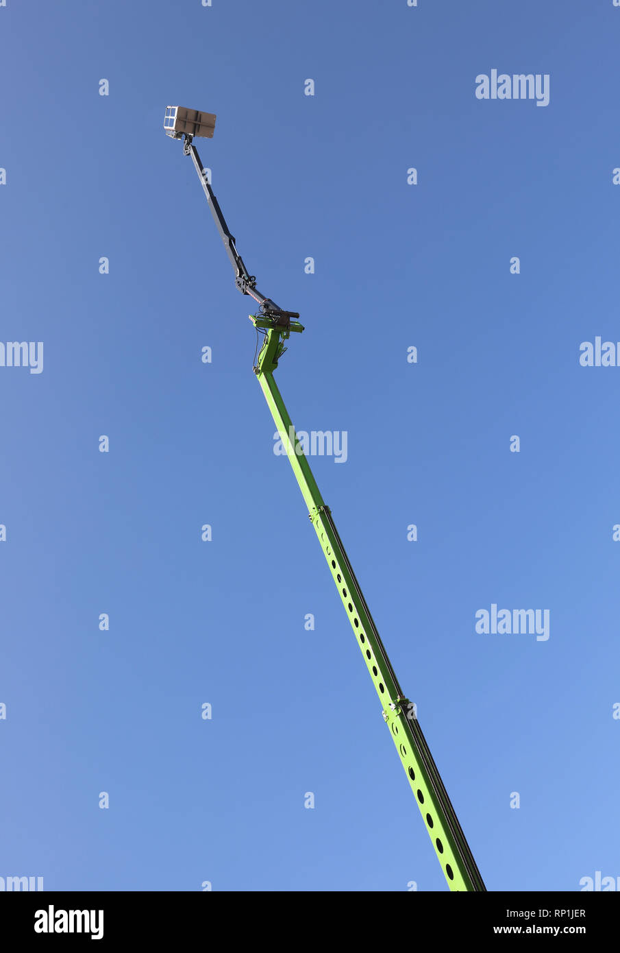 very high aerial platform with the mechanical arm to perform work at ...