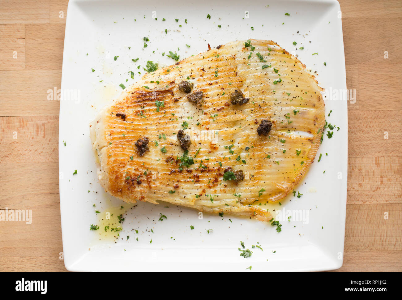 A section of a cooked ray wing from a ray caught in the UK. It has been ...