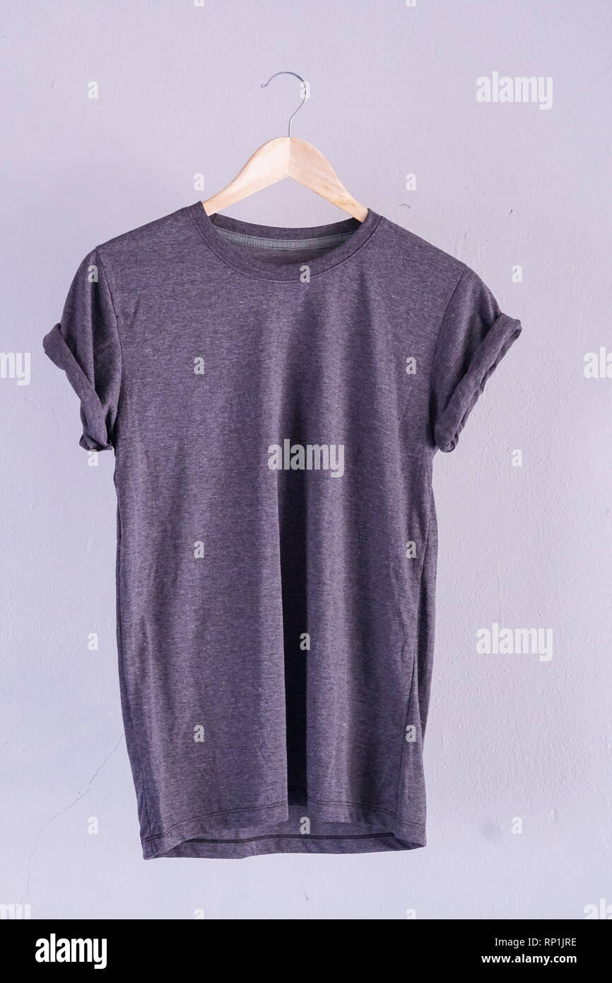 Retro fold grey cotton T-Shirt clothes mock up template on gray wall ...