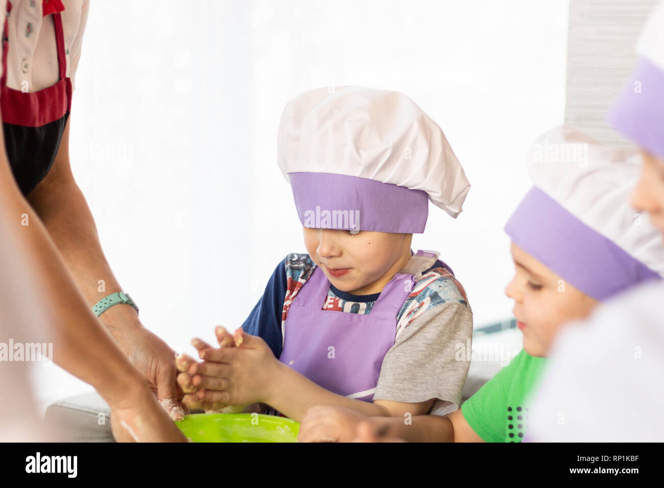 Children learn to cook cookies in the form of an asterisk. Fitness club ...