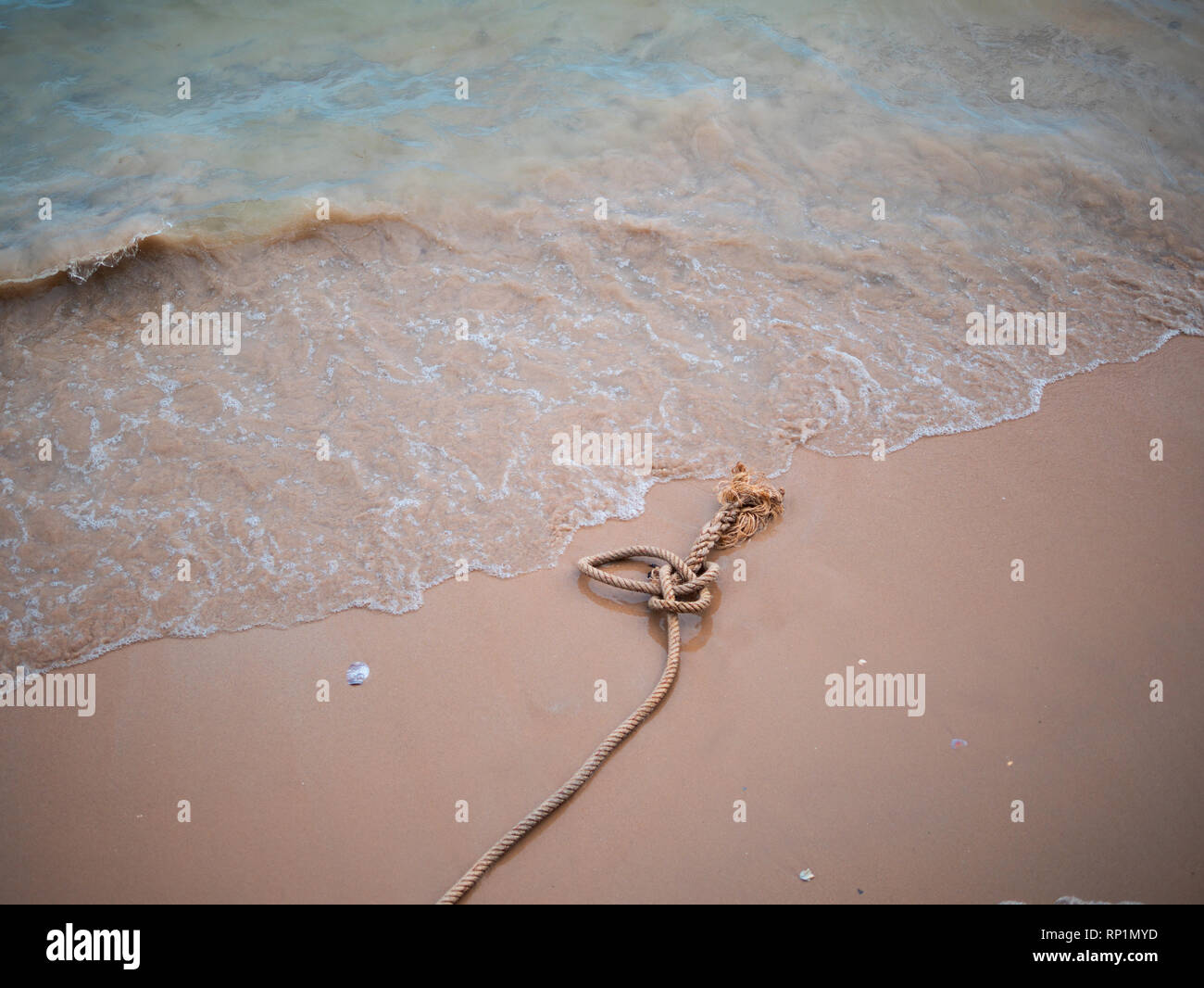 Rope on the beach sand hi-res stock photography and images - Alamy