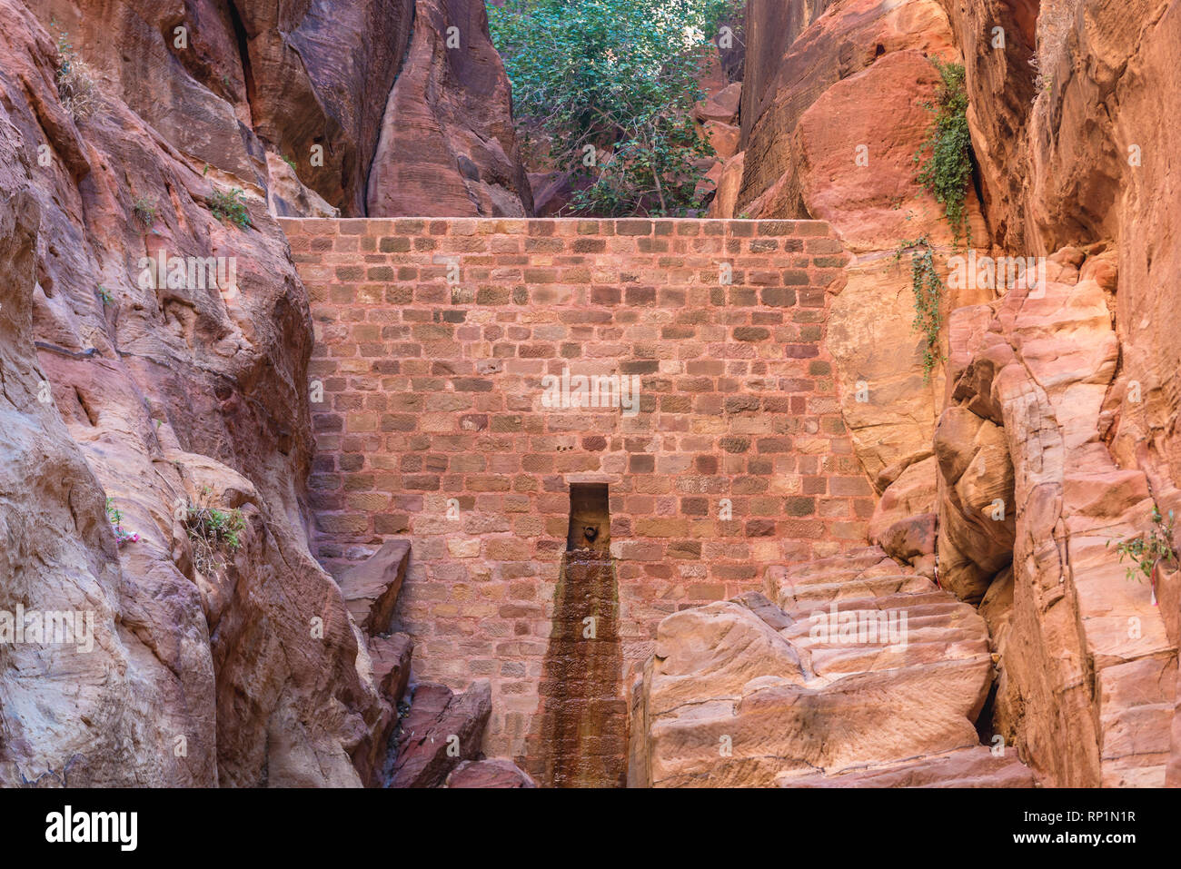 Dam in Siq canyon in Petra historical city of Nabatean Kingdom in ...
